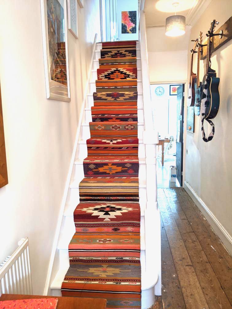 Vintage Kilim Runners Fitted To Stairs In Hallway